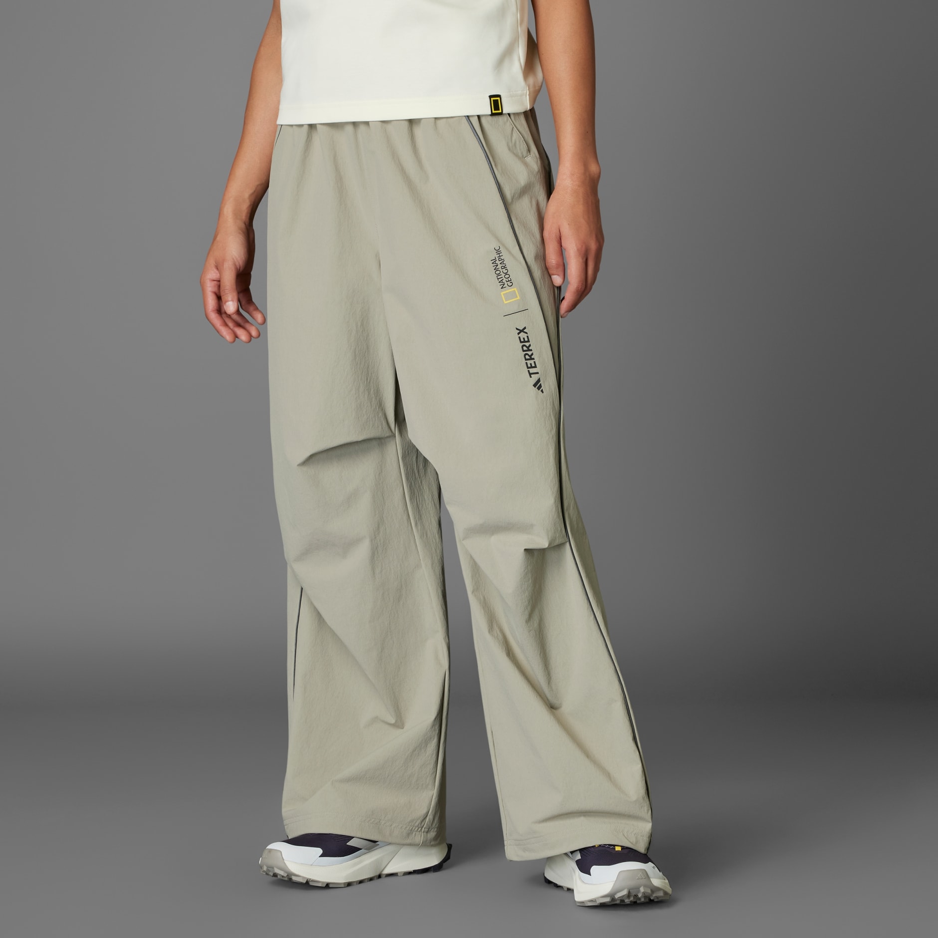 CLOTHING - adidas National Geographic AEROREADY Woven Pants - Beige ...